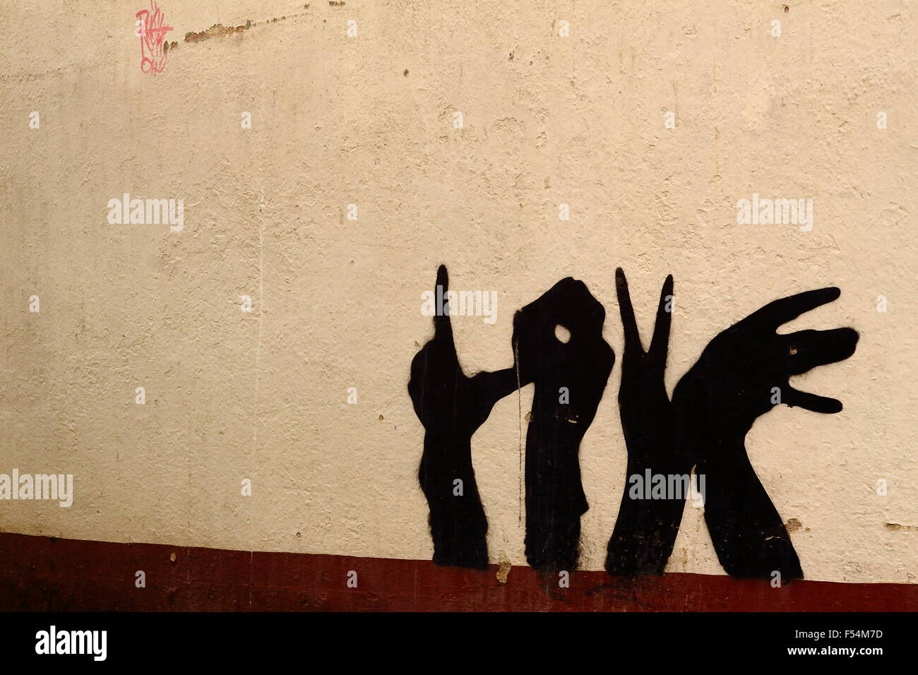 'Love' hand sign graffiti by unknown artist. On a wall in Brixham ...