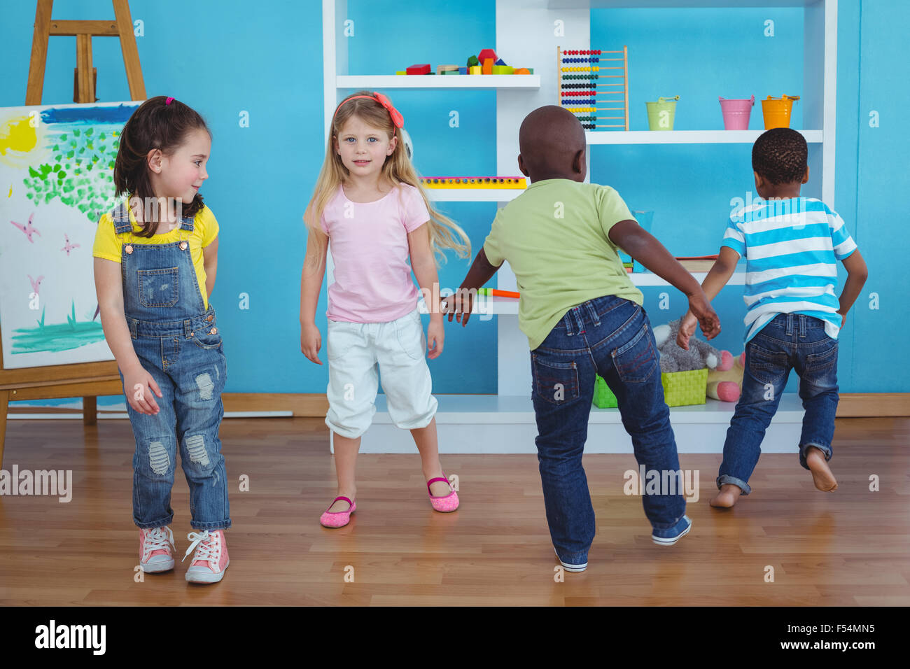 Happy kids playing games together Stock Photo - Alamy