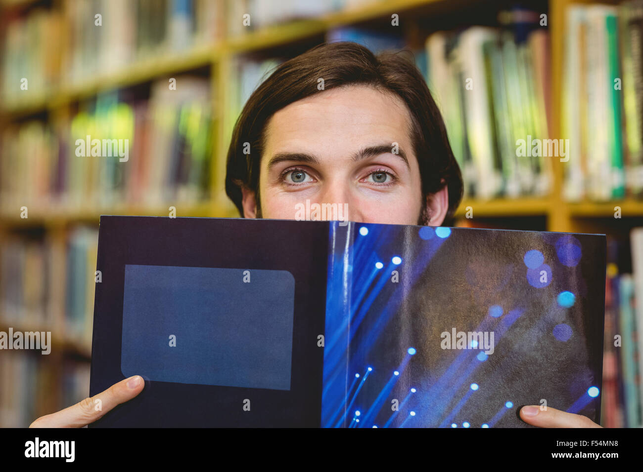 Student messing in the library Stock Photo - Alamy