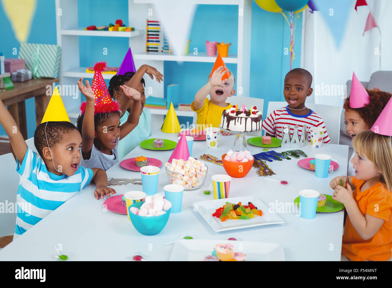 Excited kids enjoying a birthday party Stock Photo - Alamy