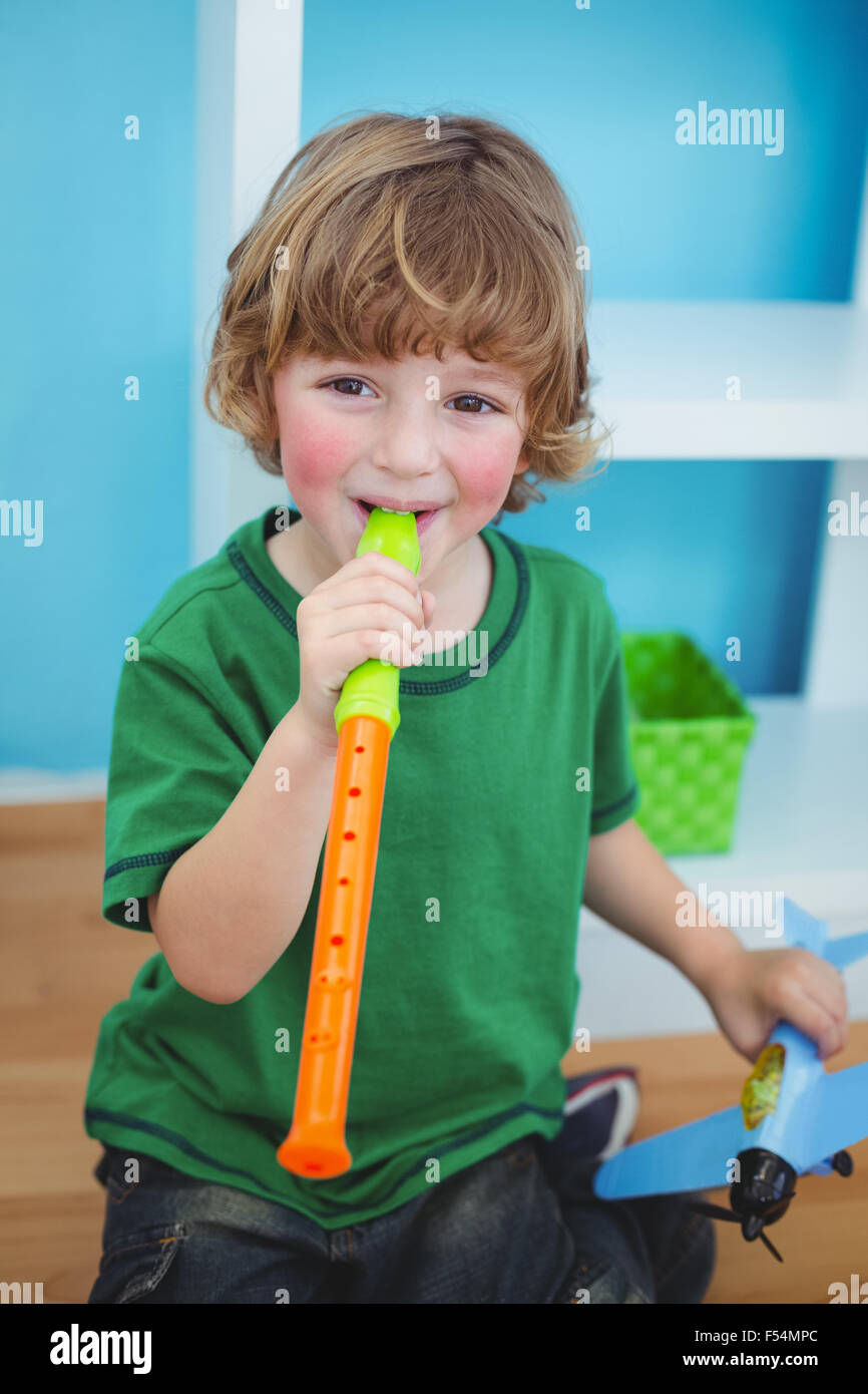 Boy playing flute hi-res stock photography and images - Alamy