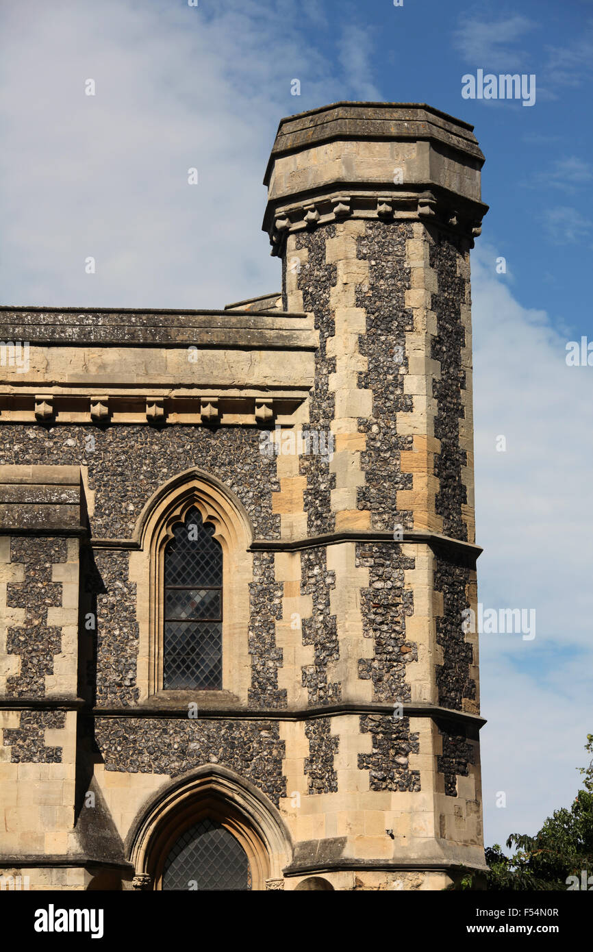 Part of the old town gatehouse with leaded windows and stone and flint ...