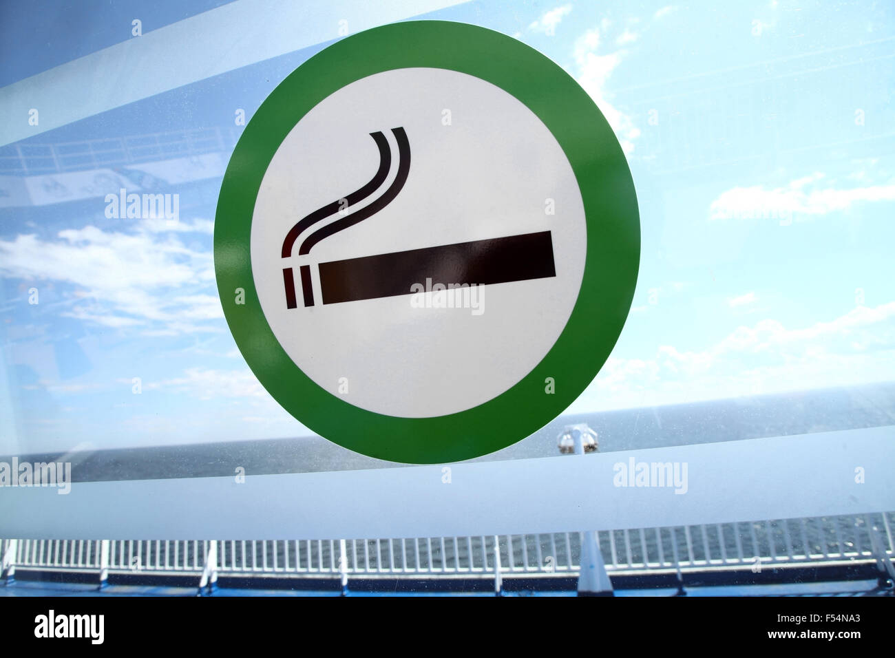 Picture of a sign marking the designated smoking area on a window Stock ...