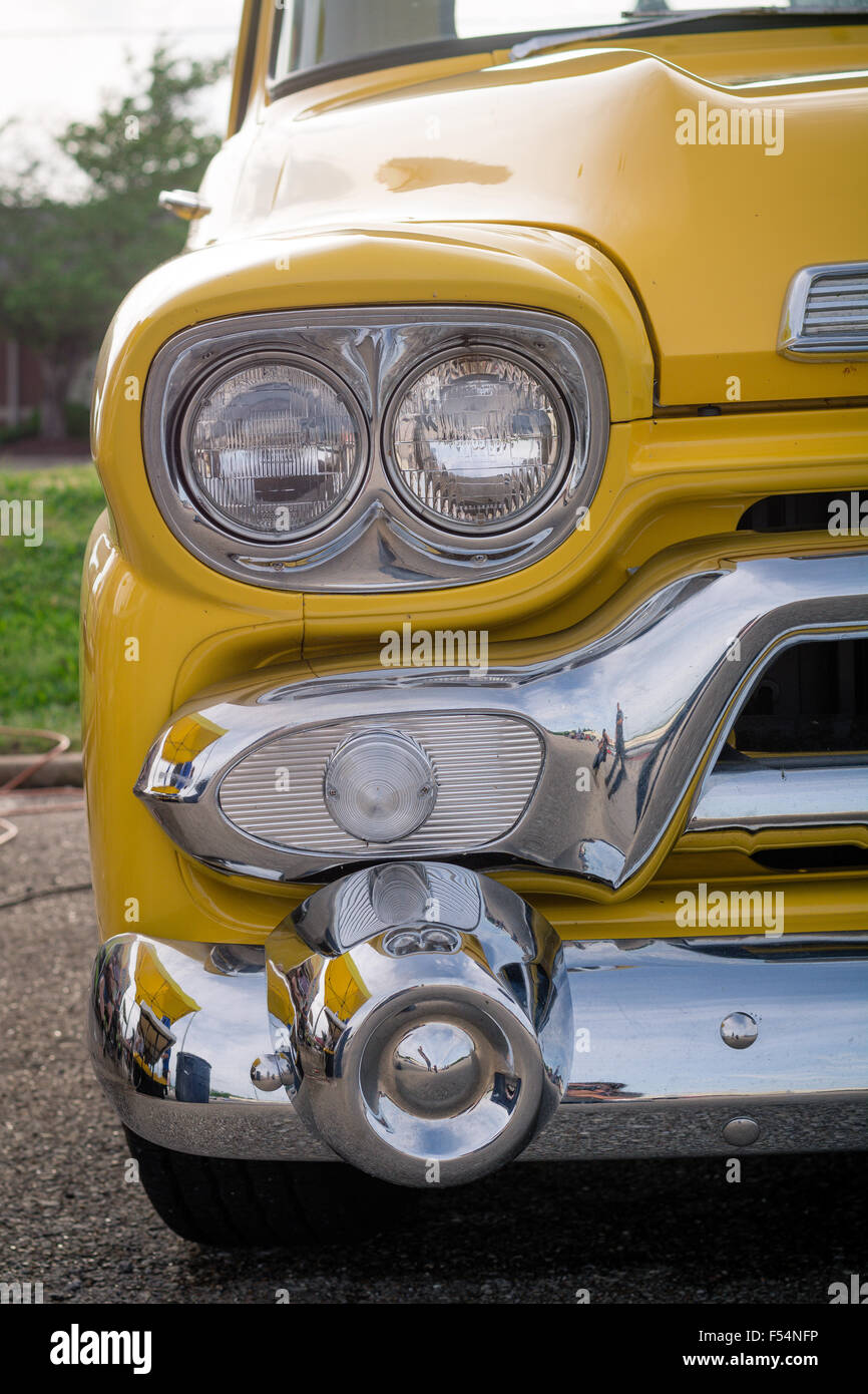 Old yellow GMC truck headlights and bumper Stock Photo - Alamy