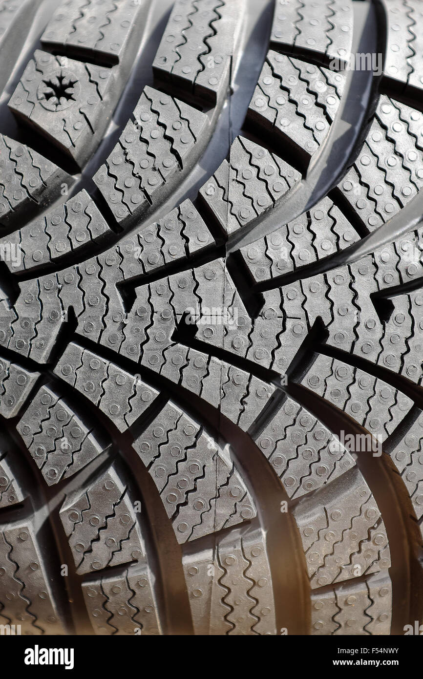 Brand new winter snow tire for car showing rubber tread profile with ...