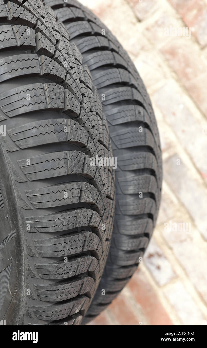 Brand new winter snow tire for car showing rubber tread profile with ...