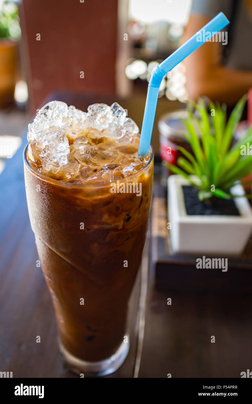 ice coffee with milk on topping drinking in glass on table Stock Photo ...