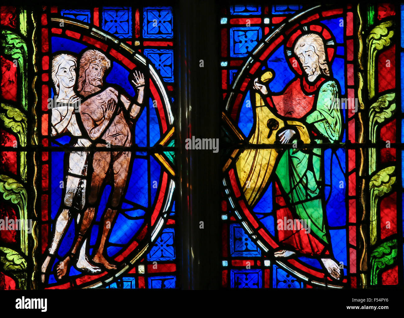 Stained glass window depicting Adam and Eve in the Cathedral of Tours, France Stock Photo - Alamy