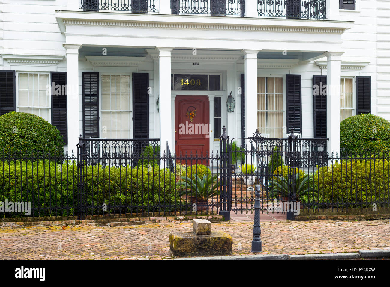 Traditional grand mansion house with columns and porch in the Garden ...