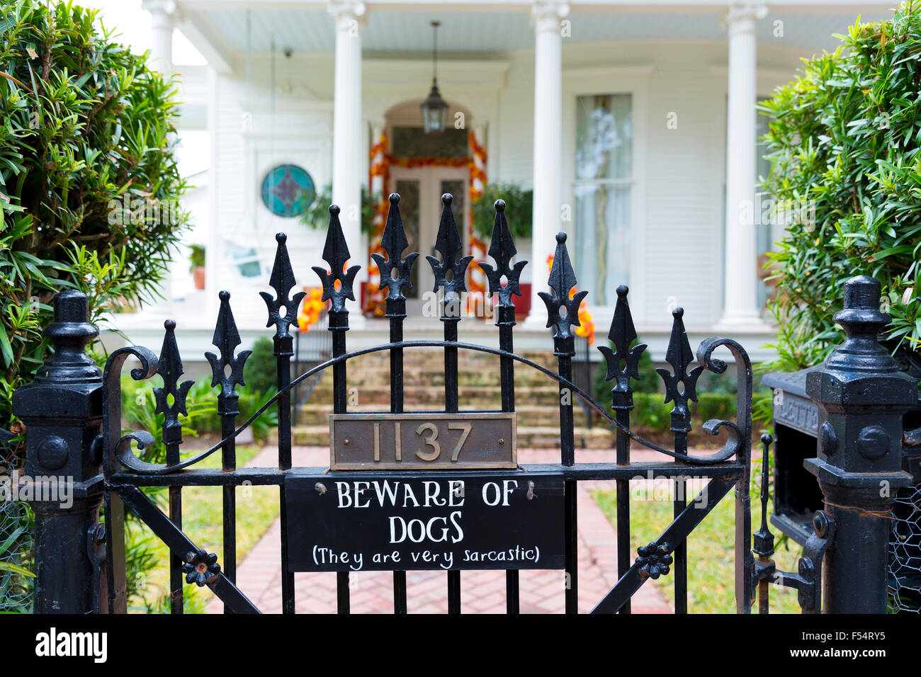 Beware of Dog joke sign on traditional grand mansion house in the ...