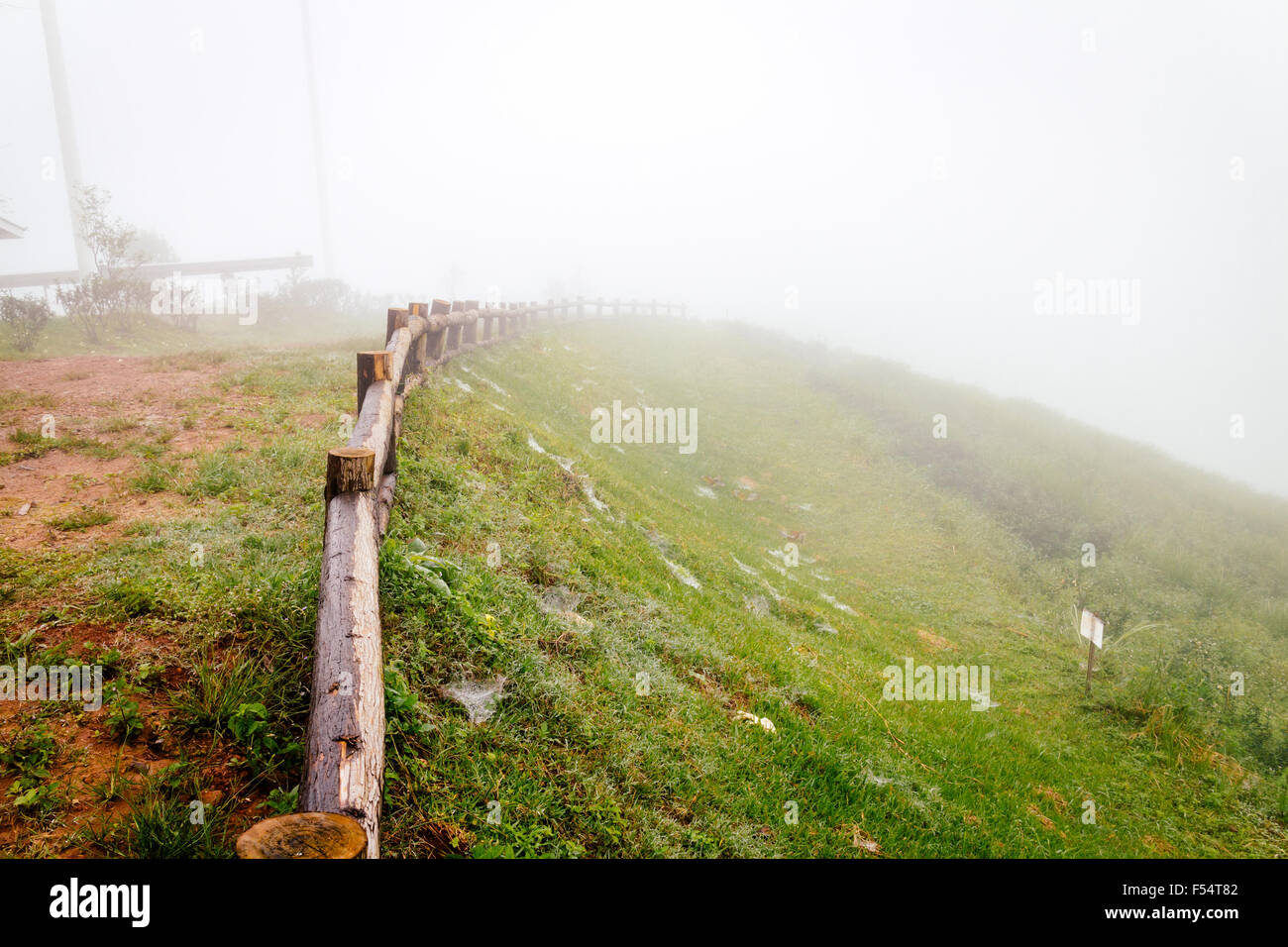 old wood fence in garden with misty fog Stock Photo - Alamy