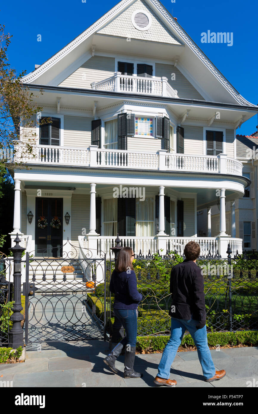 Tourists tour grand mansion houses in the Garden District of New ...