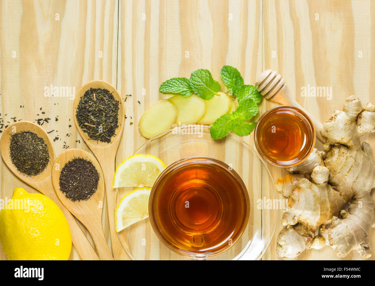 tea with mint honey ginger and lemon on wood background,warm toning, selective focus Stock Photo ...