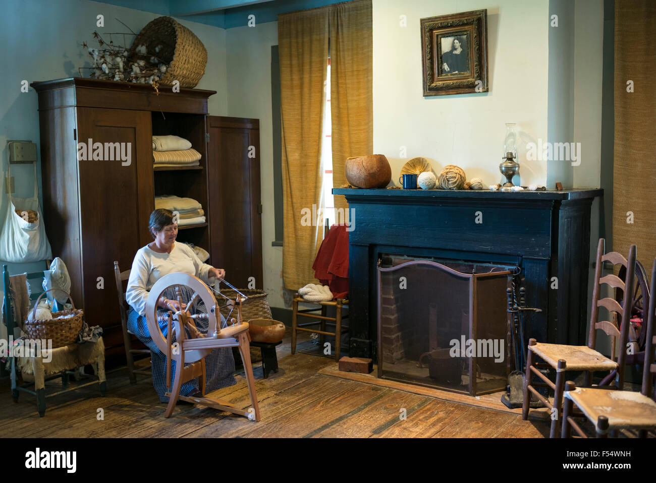 Craftsperson spinning cotton, Vermilionville museum of Acadian Cajun ...