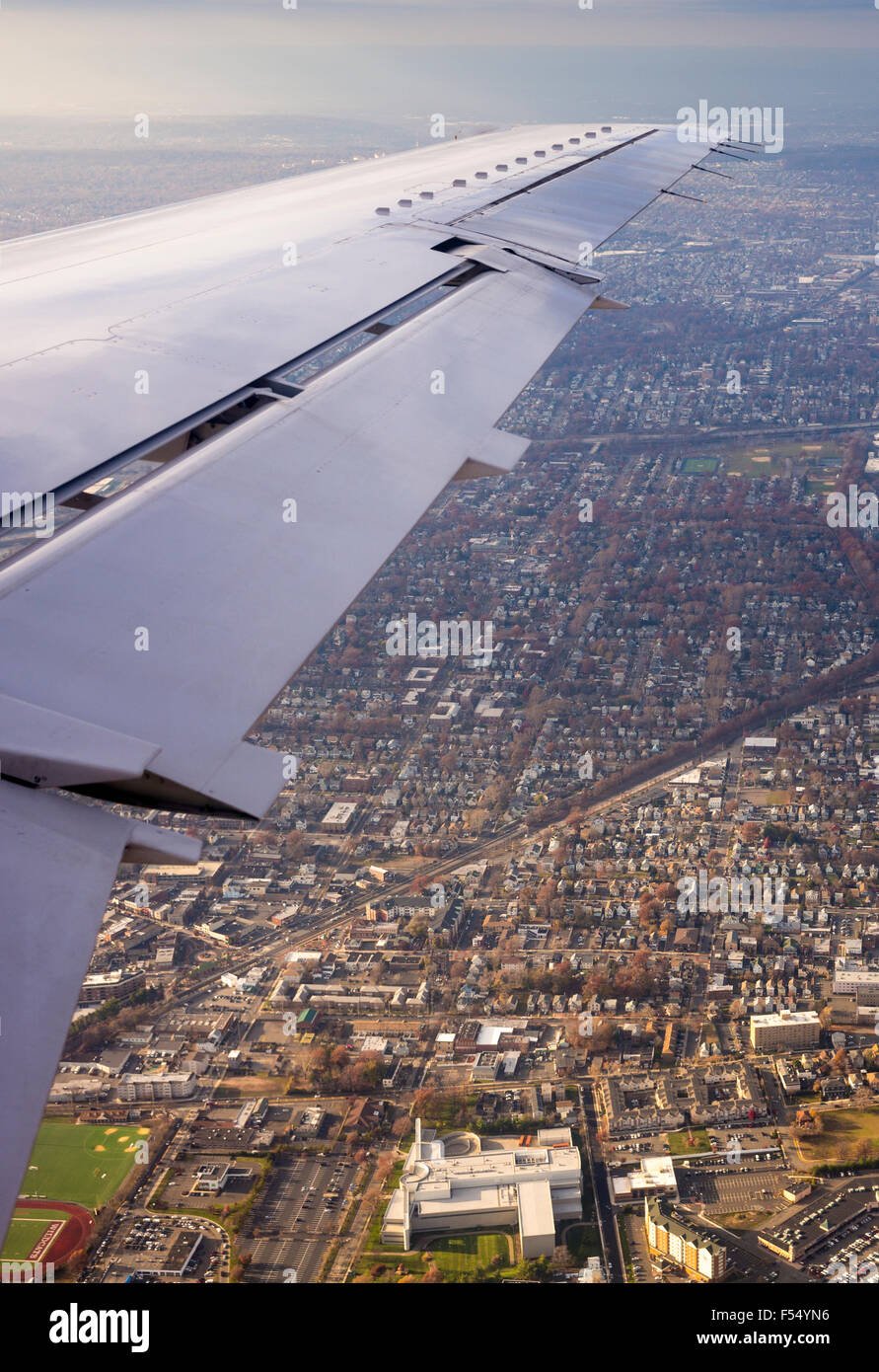 Aerial view from window of a jet aircraft flying into New York, USA ...