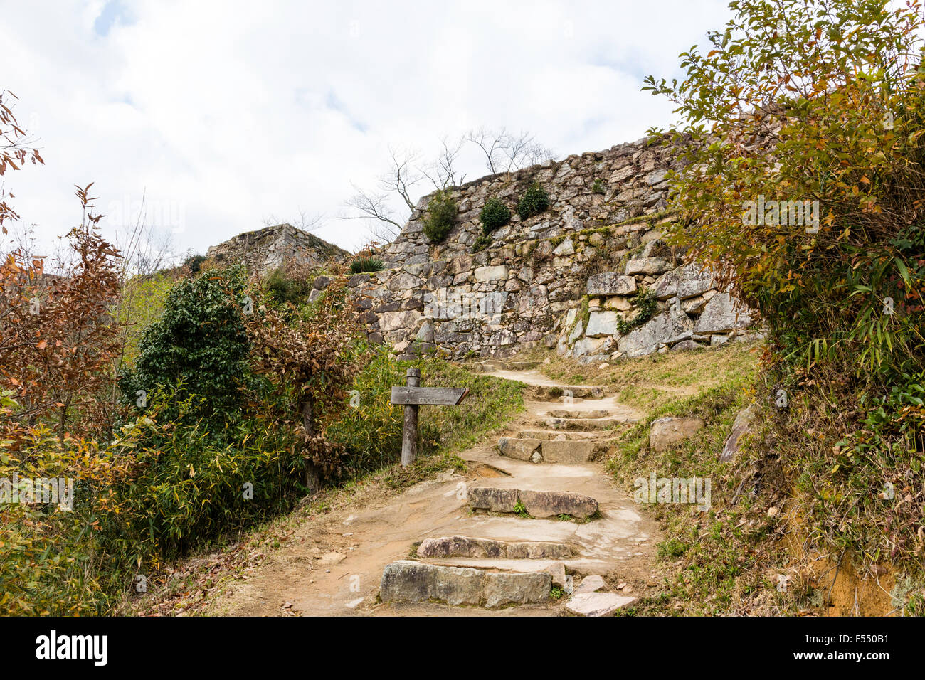Japan, Takeda castle. Hill top ruin, path and stone steps leading to ...