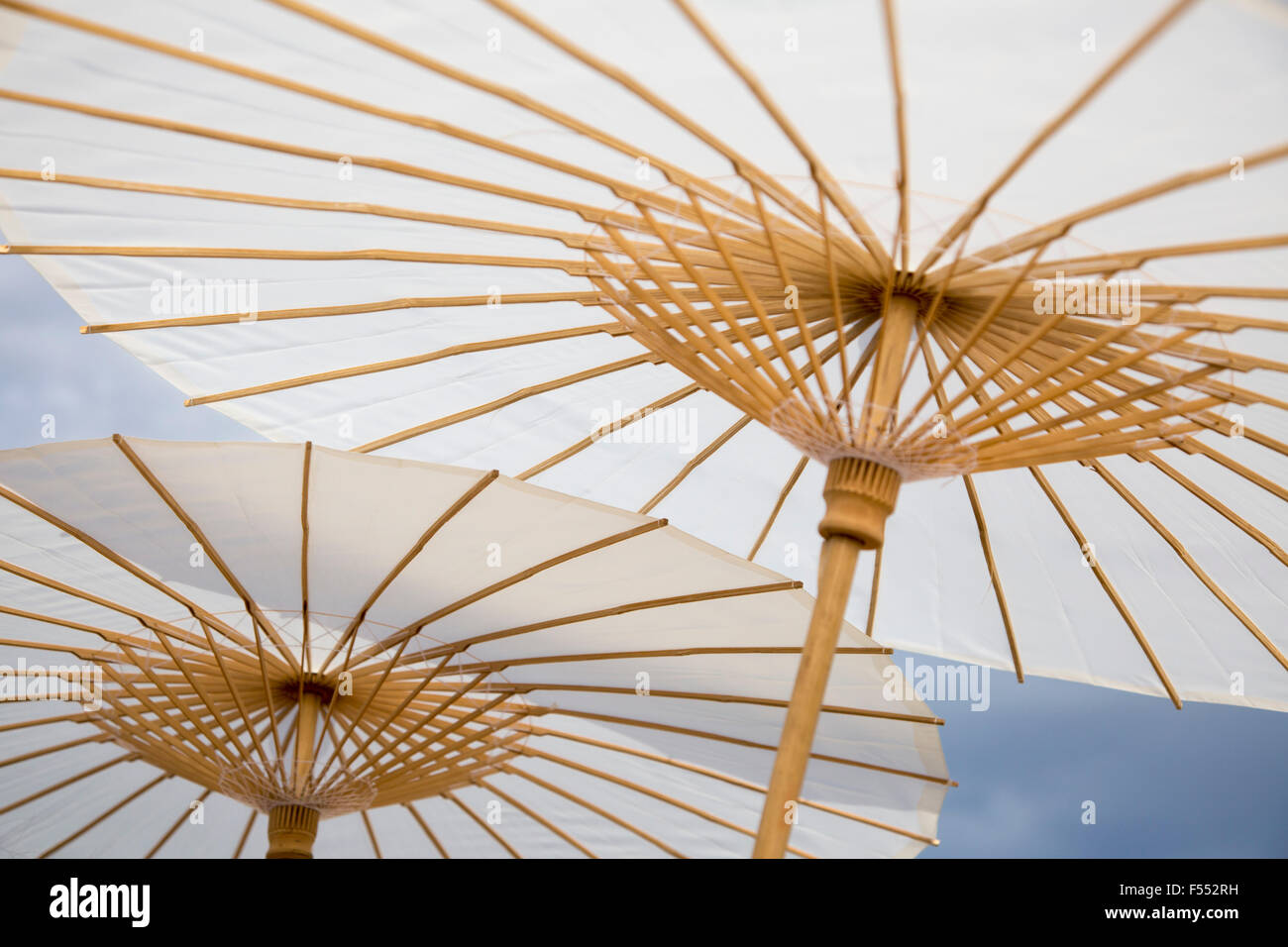 Low angle view of traditional parasols against sky Stock Photo - Alamy