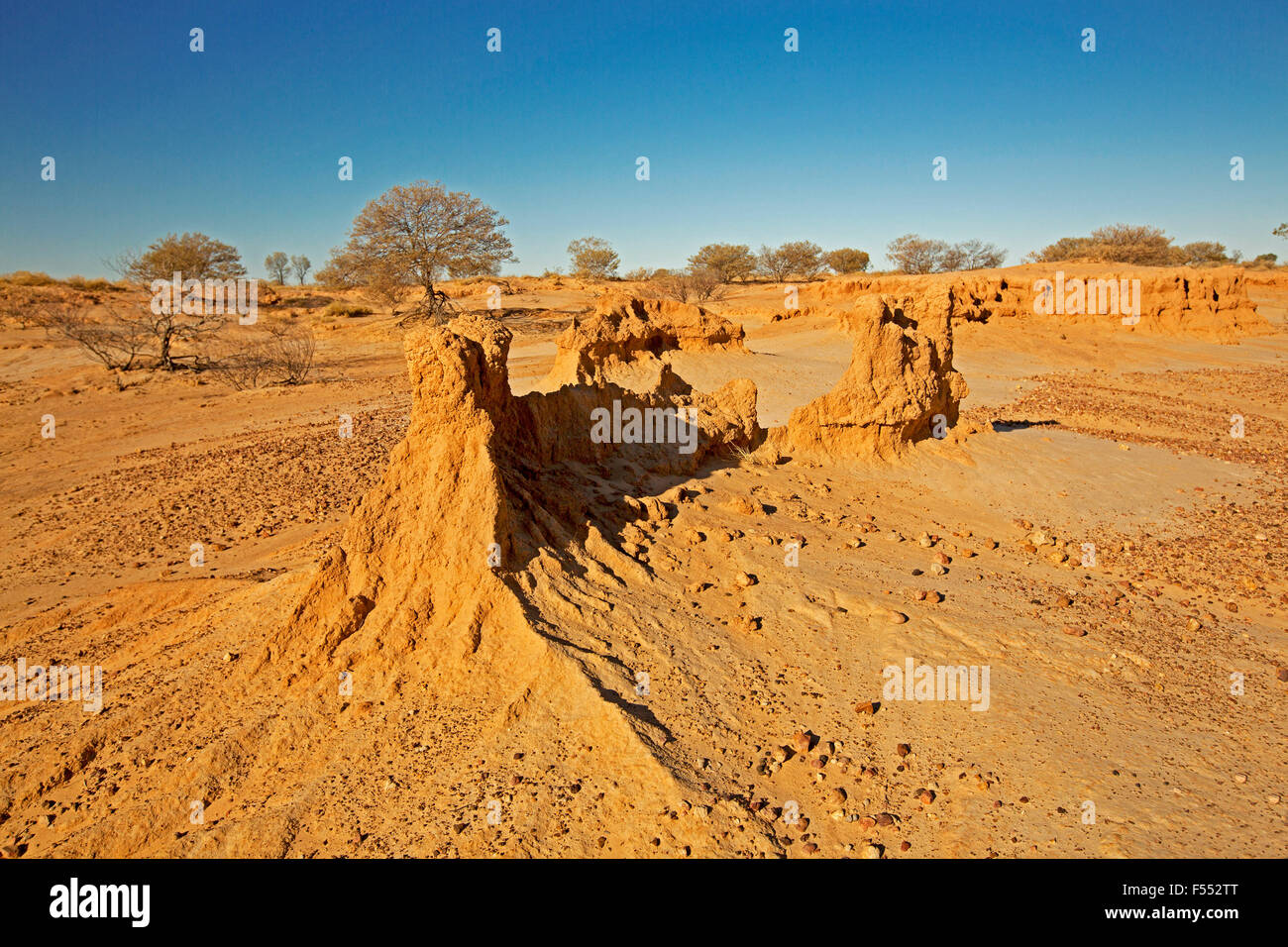 Unique eroded formations in barren red desert landscape, outback ...