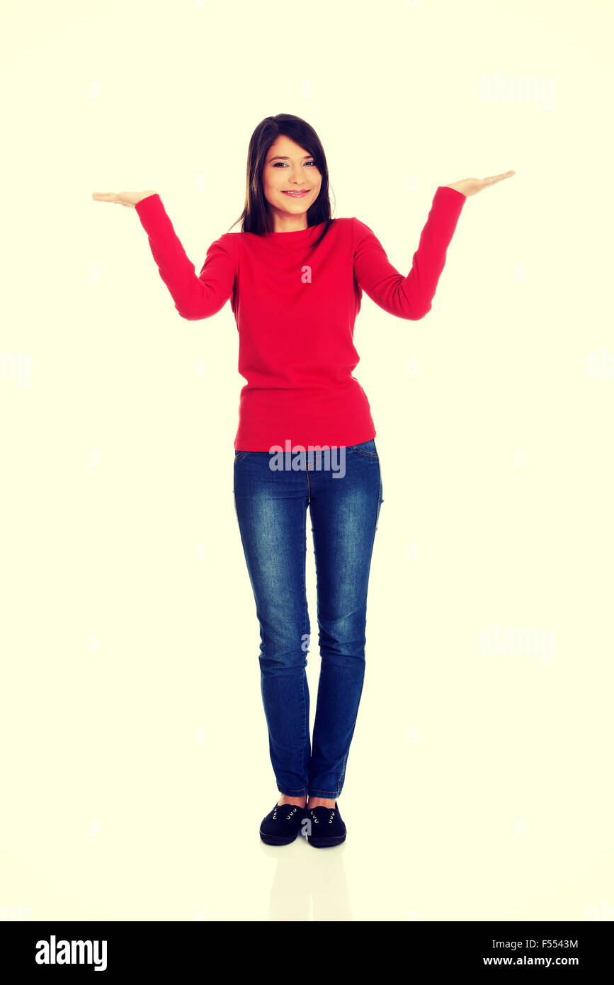 Woman making a scale with her arms Stock Photo - Alamy