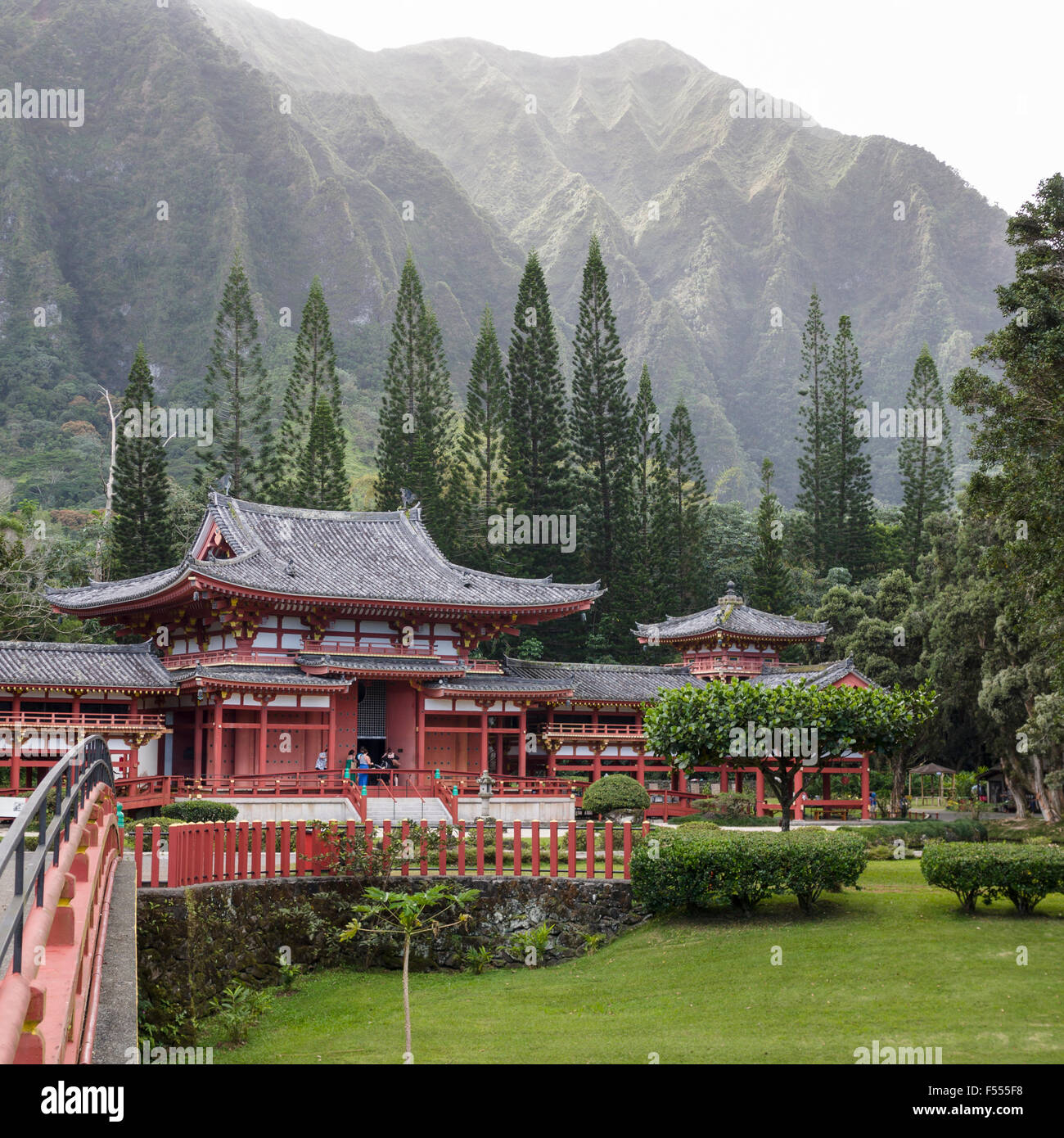 Byodo-in Temple and the surrounding misty mountains. This peaceful ...