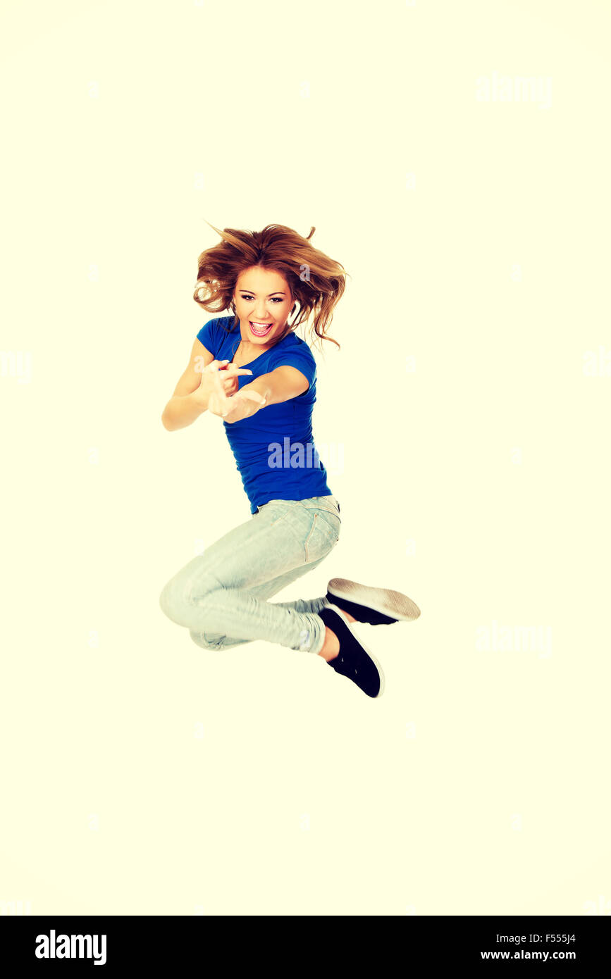 Young happy woman jumping Stock Photo - Alamy