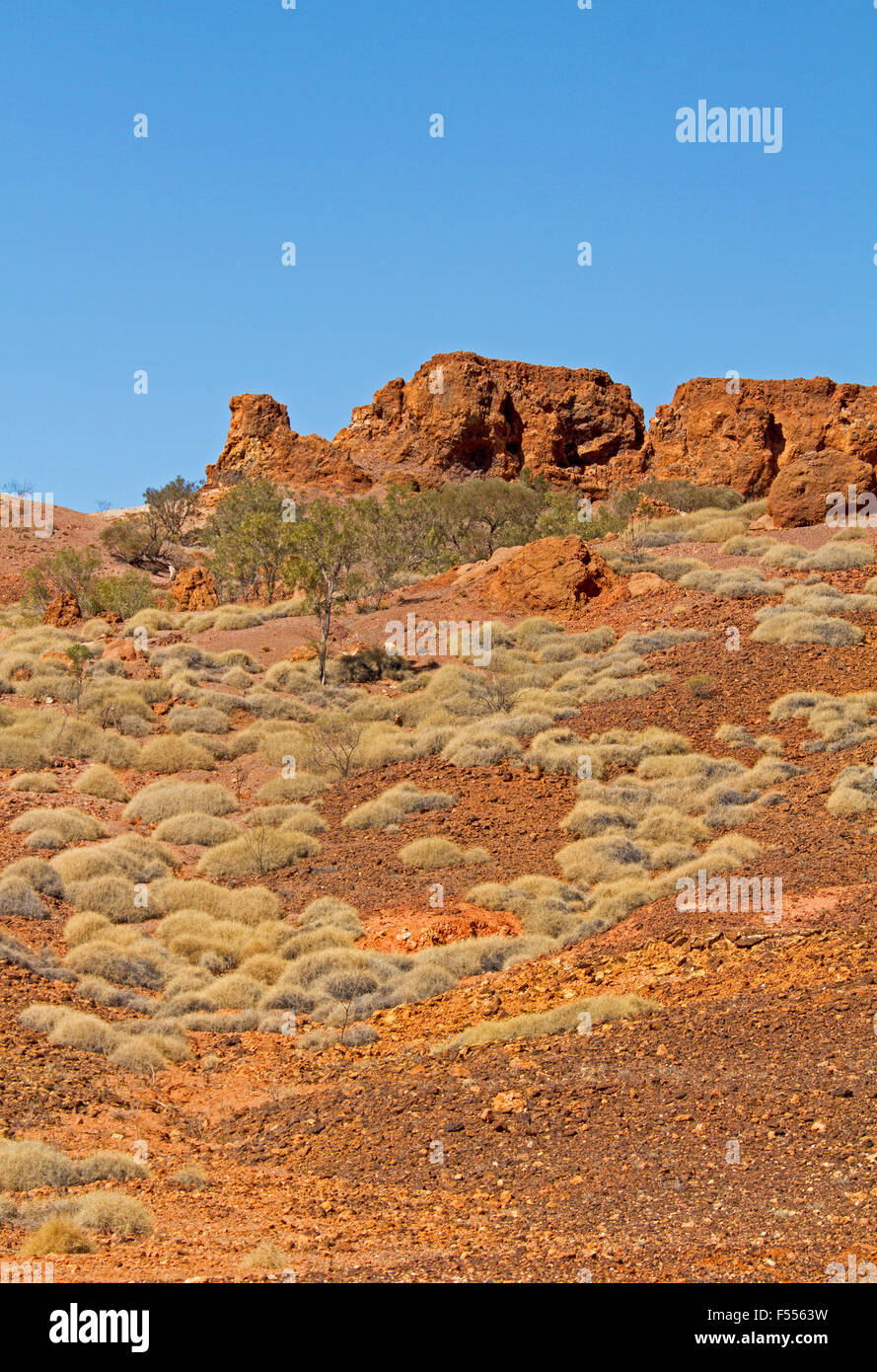 Australian outback landscape with rugged red rocky hill and barren ...