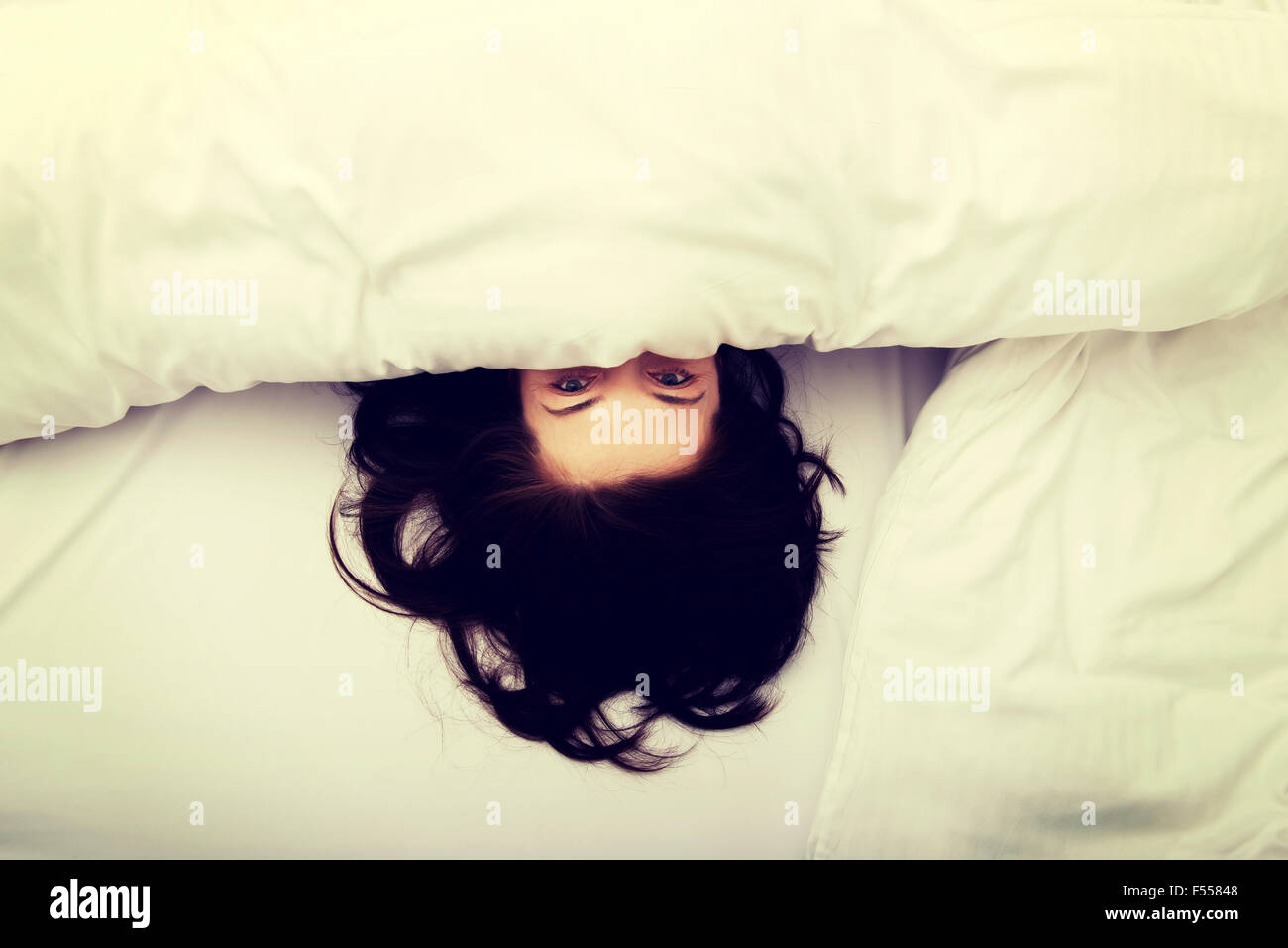 Young woman bed scared hi-res stock photography and images - Alamy