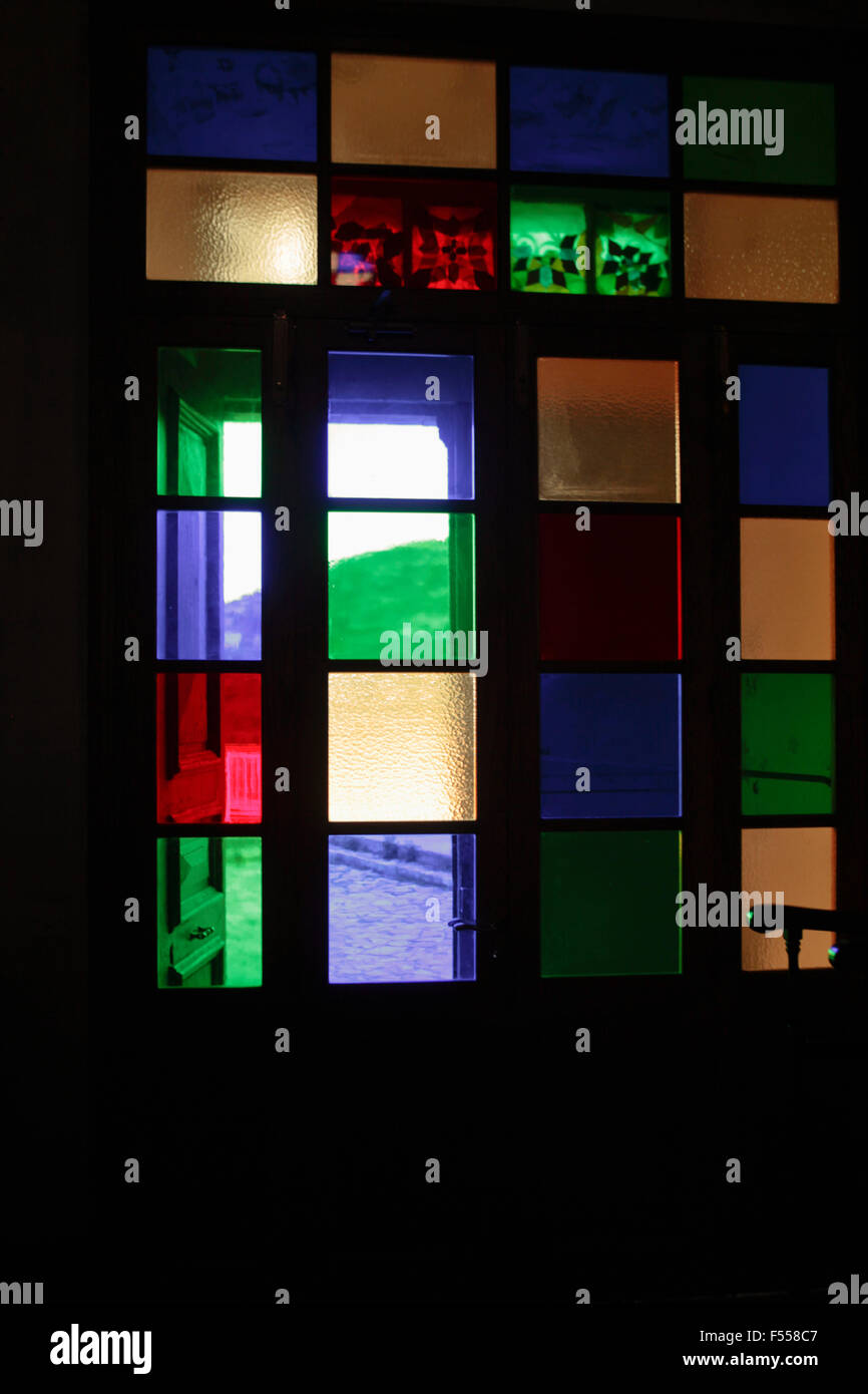 Multi colored window in building Stock Photo - Alamy