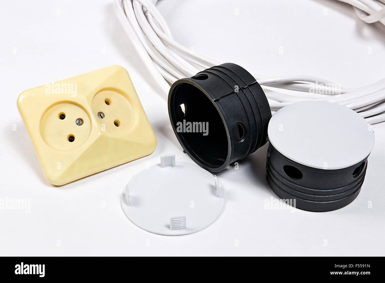 Electric wall socket, socket box, power cable on white background Stock ...