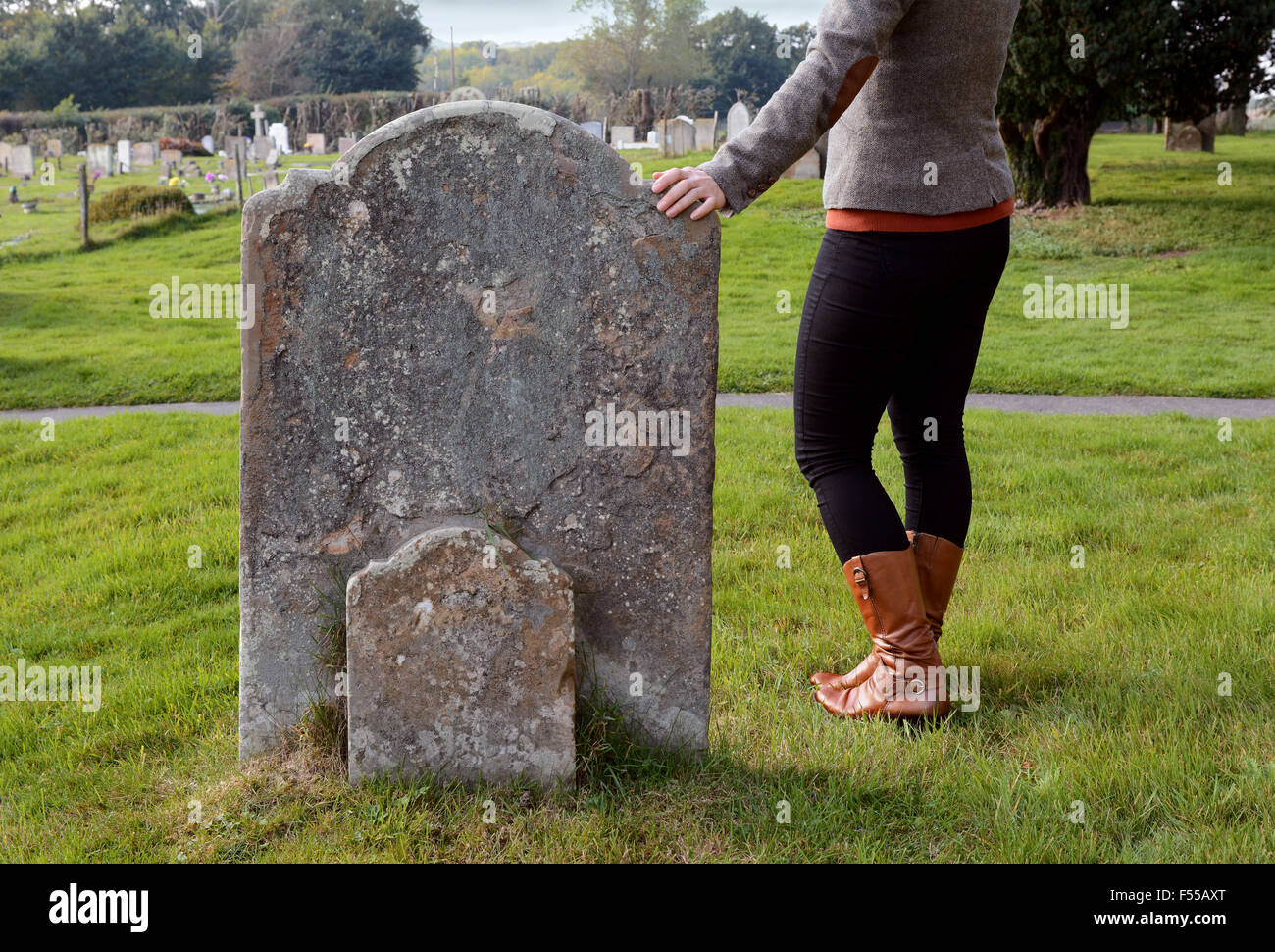 Woman standing grave in cemetery hi-res stock photography and images ...