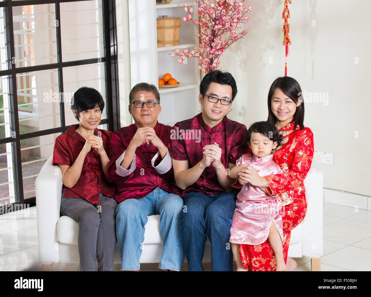 asian family with chinese new year greetings Stock Photo - Alamy