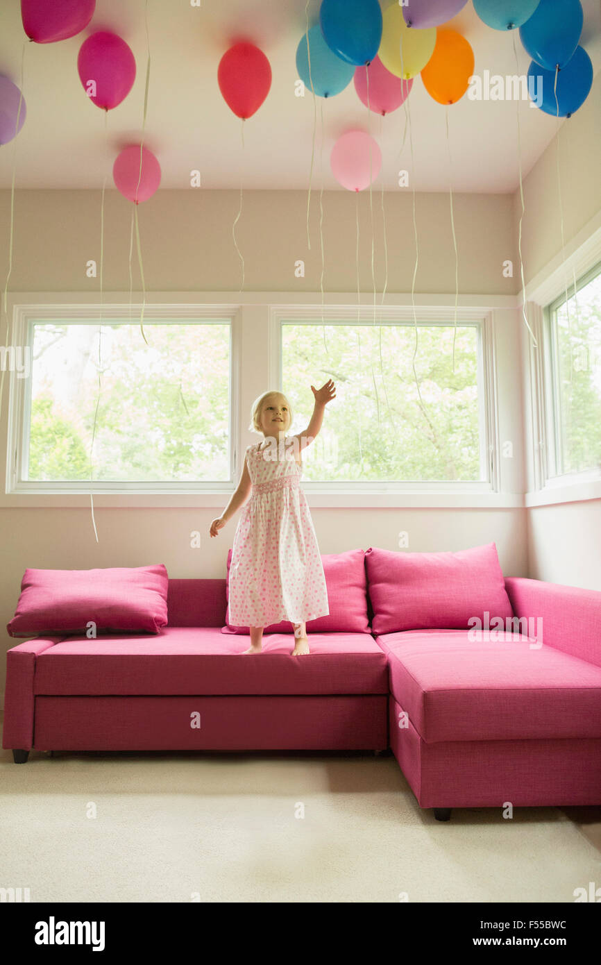 Girl reaching balloon hi-res stock photography and images - Alamy