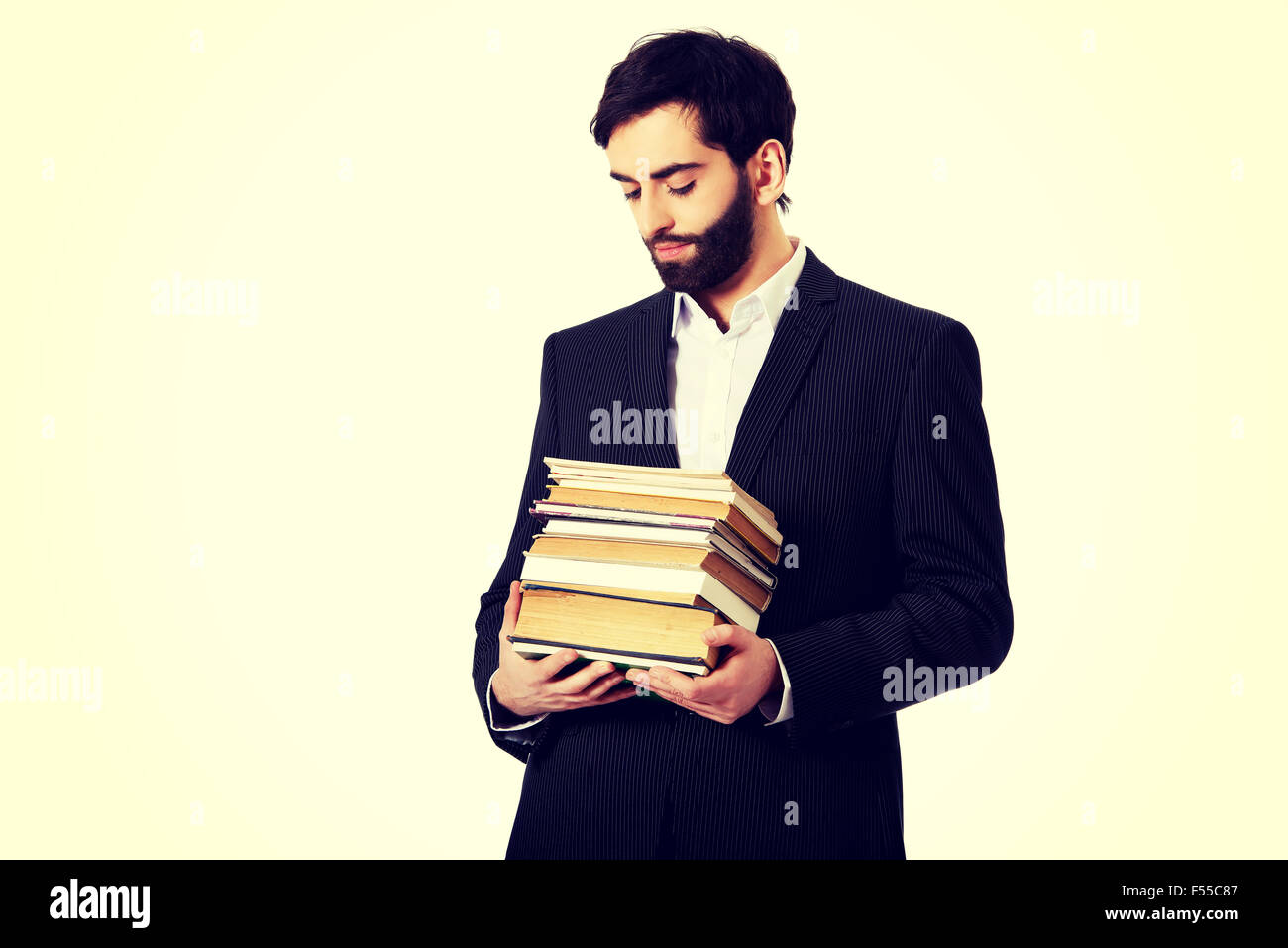 Person holding stack of books hi-res stock photography and images - Alamy