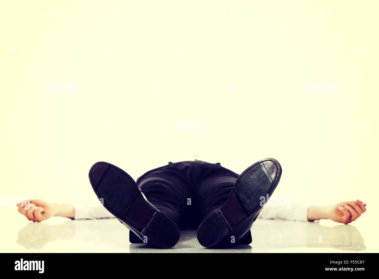 Exhausted businessman lying on the floor Stock Photo - Alamy