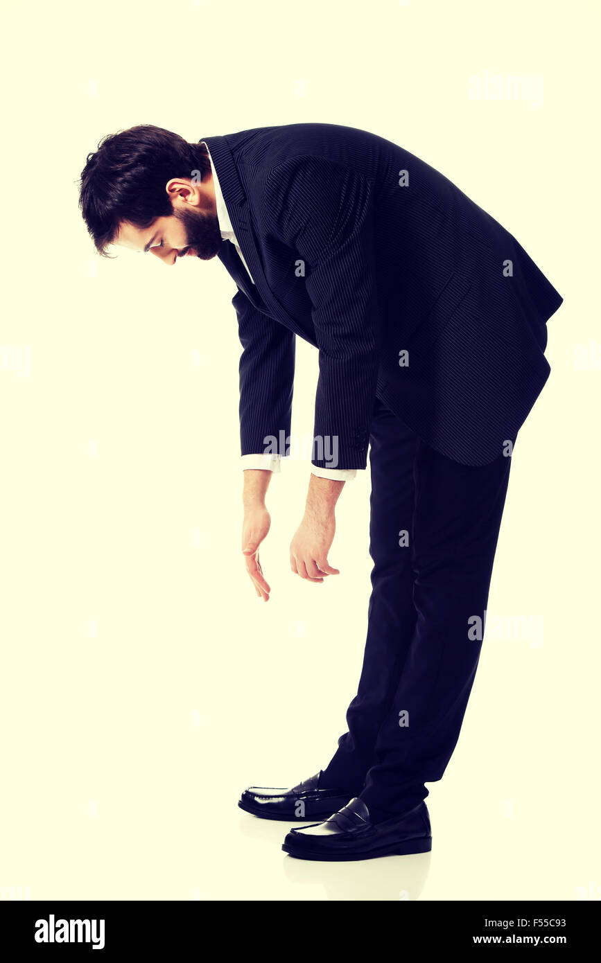 Bending down hi-res stock photography and images - Alamy