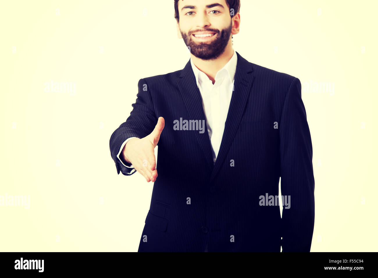 Businessman offering a handshake Stock Photo - Alamy