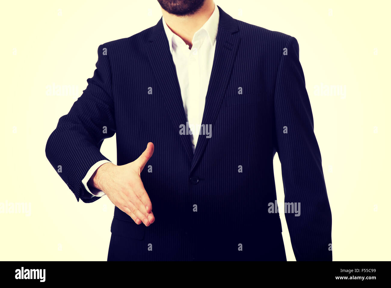 Businessman offering a handshake Stock Photo - Alamy