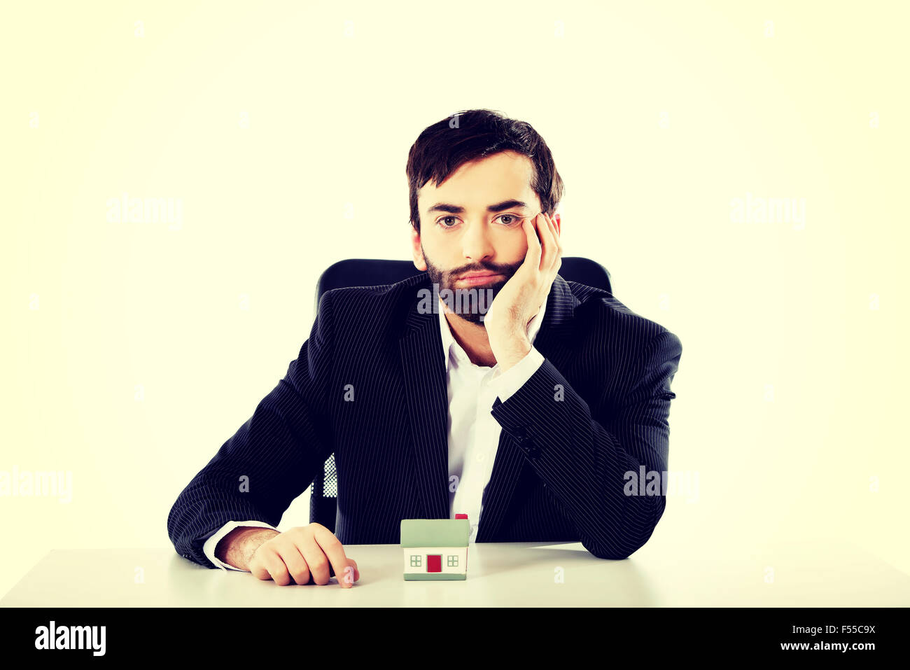 Businessman in office holding house hi-res stock photography and images ...
