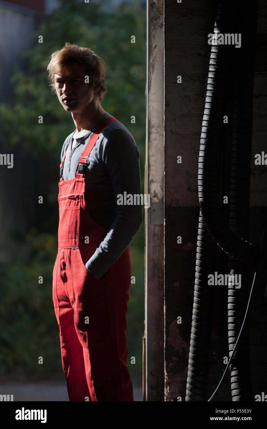 Standing looking automobile uniform hi-res stock photography and images ...