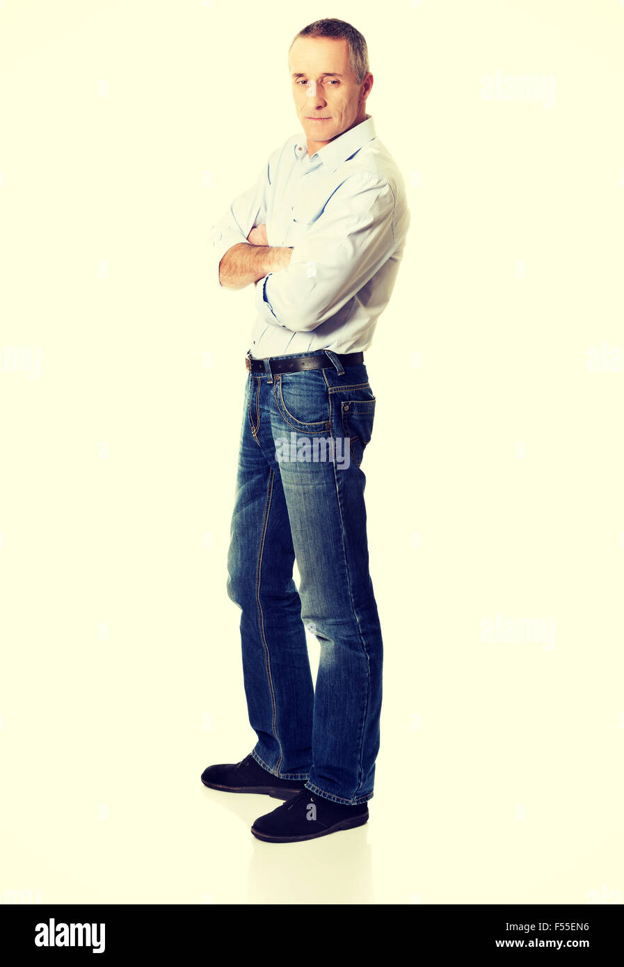 Handsome man with folded arms Stock Photo - Alamy