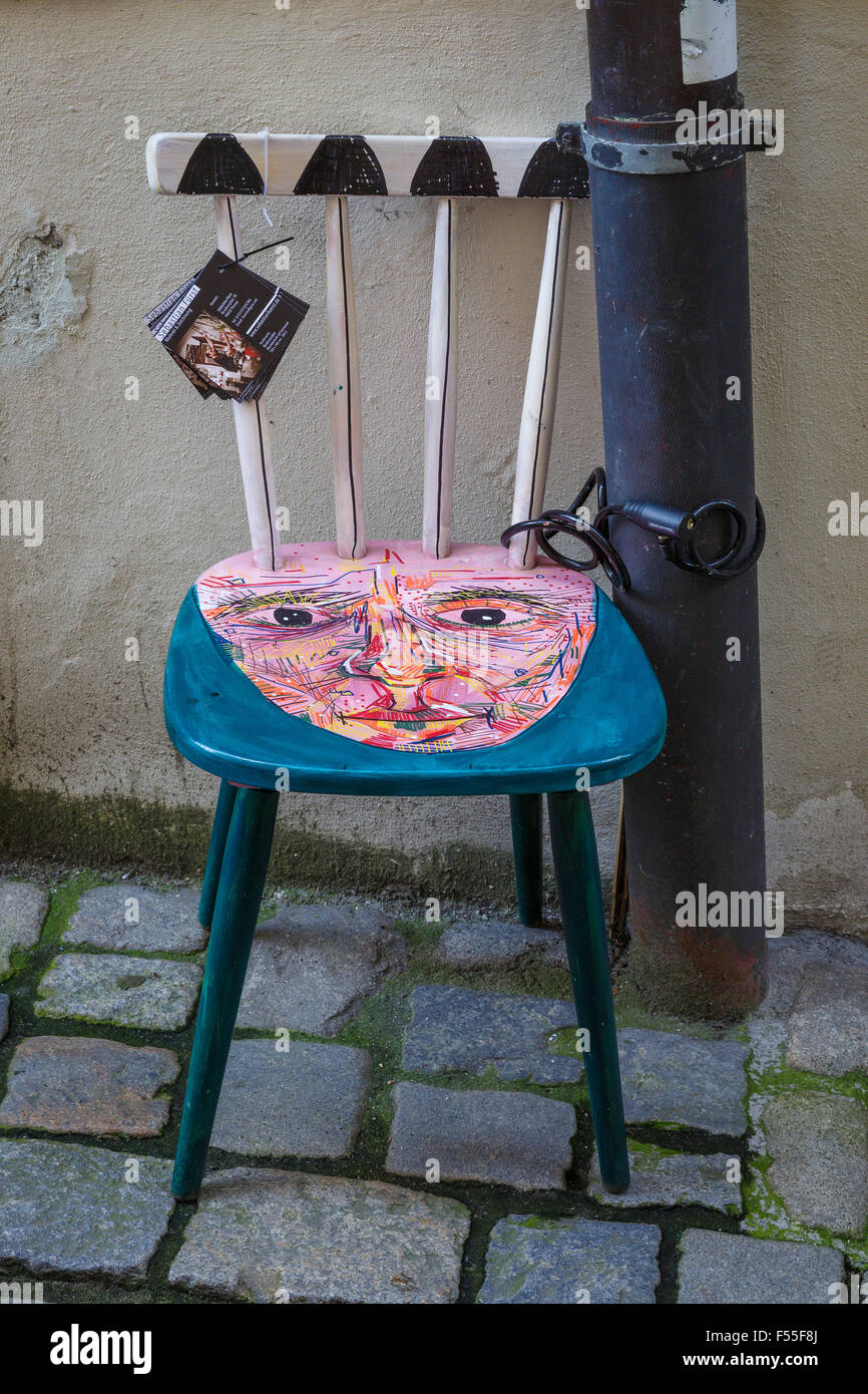 An artists painted chair in Artists Alley, Passau, Germany Stock Photo ...
