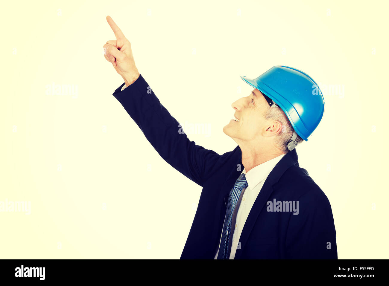 Businessman engineer pointing up Stock Photo - Alamy