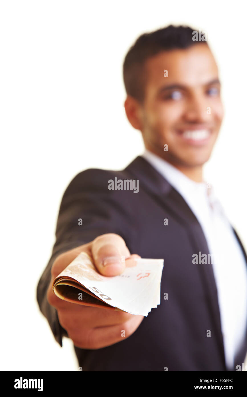 Young business man offering a stack of money Stock Photo - Alamy