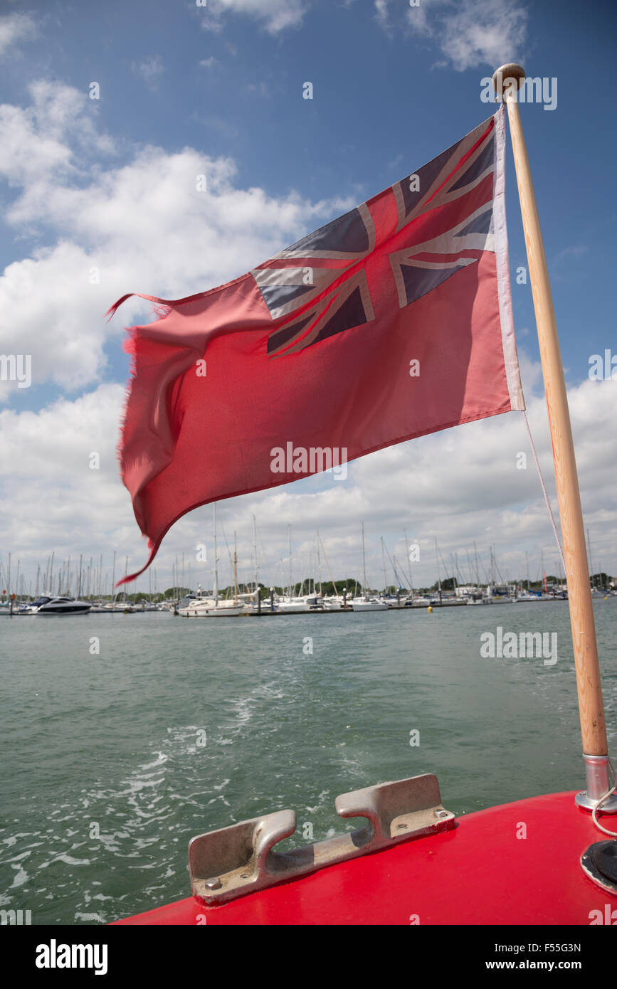 A british flag blows in the wind on the stern of a boat Stock Photo - Alamy