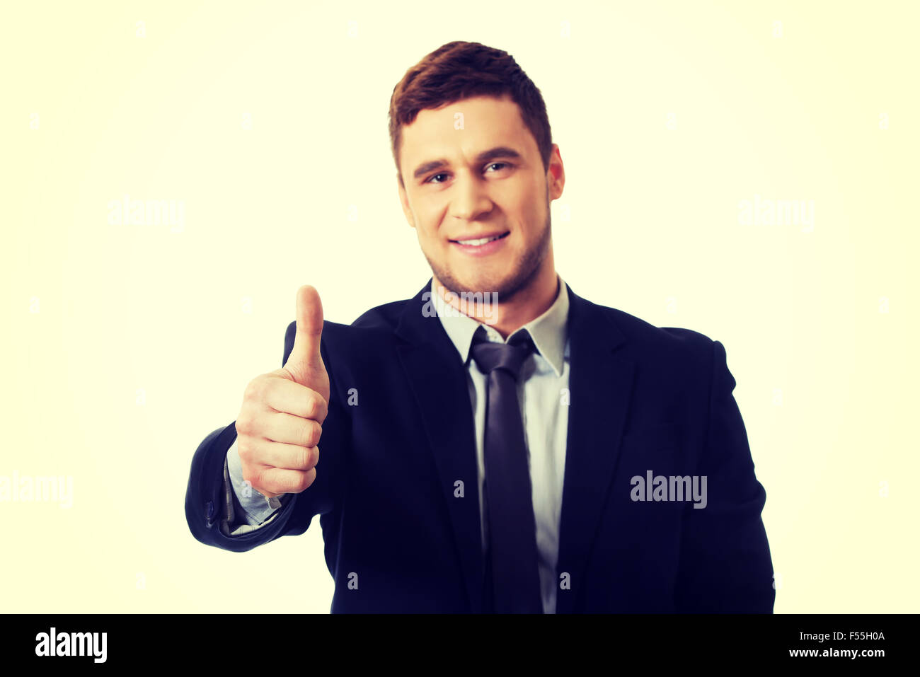 Happy smiling businessman with thumbs up Stock Photo - Alamy