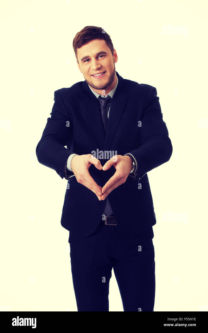 Man is showing a love sign by his hands Stock Photo - Alamy