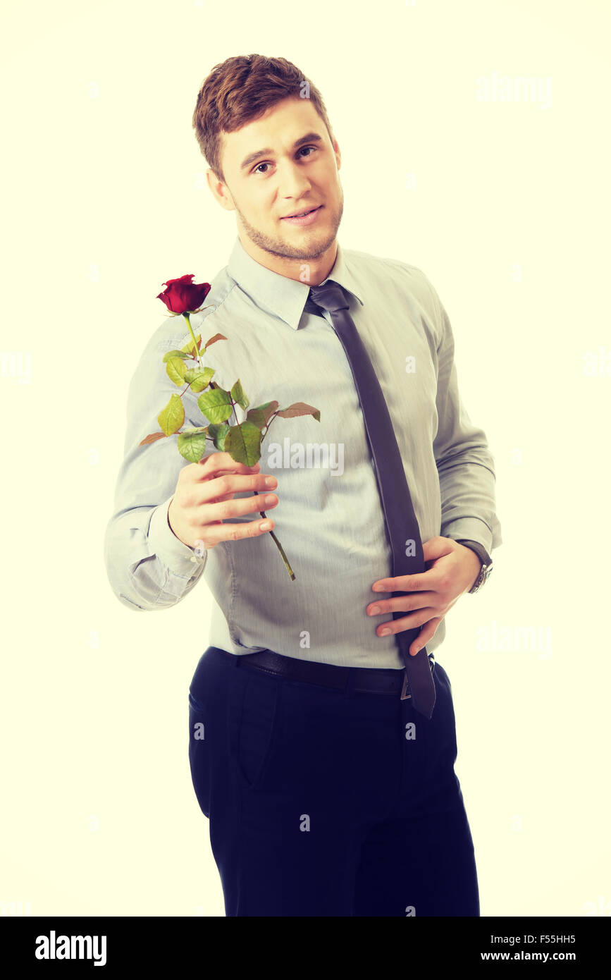 Romantic young man giving rose hi-res stock photography and images - Alamy