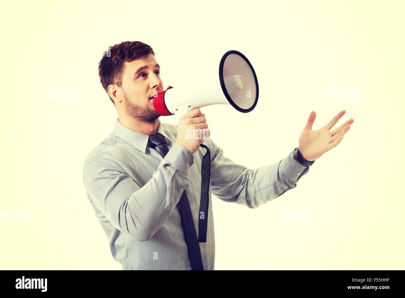 Businessman shouting through megaphone Stock Photo - Alamy