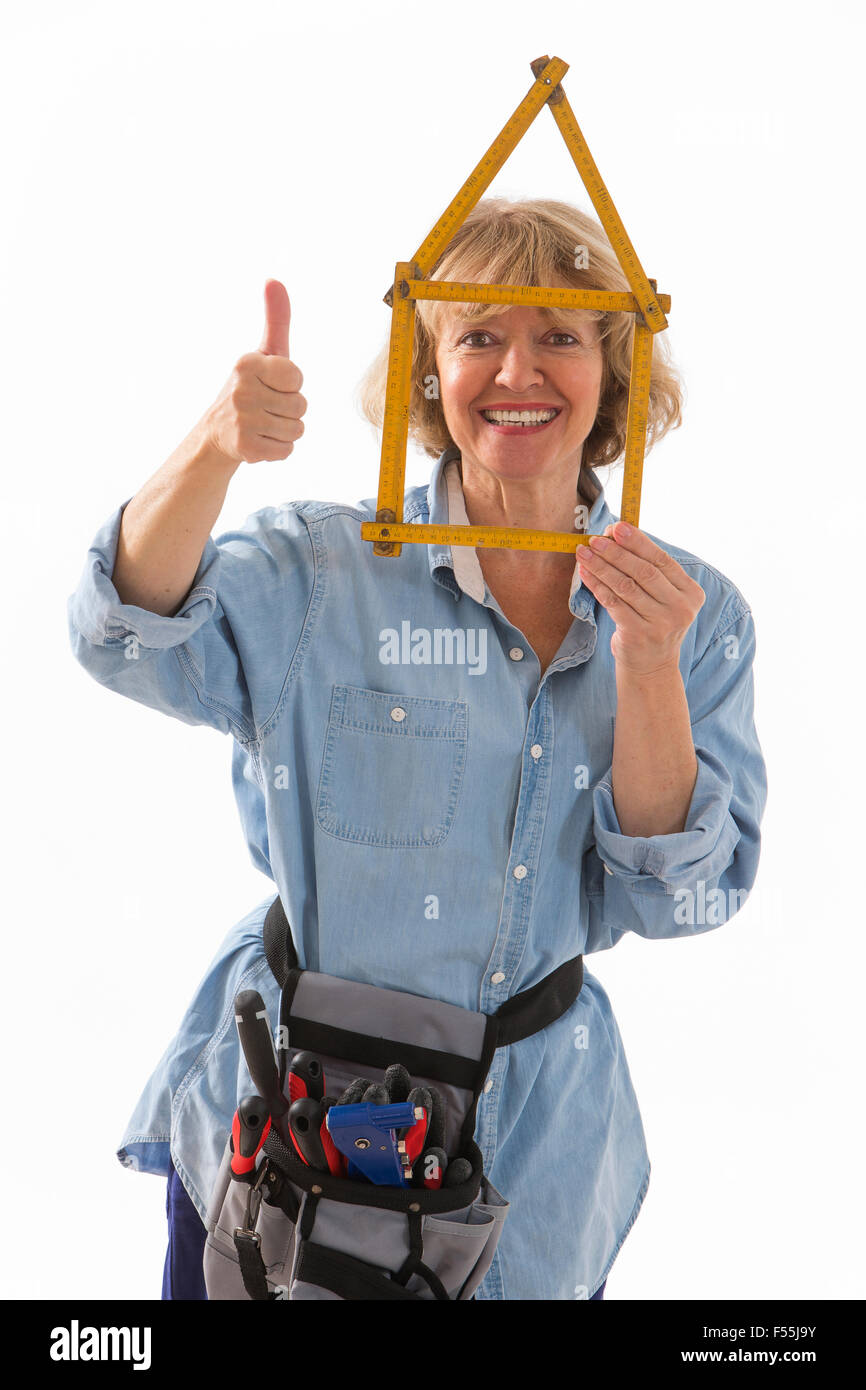 Woman house ruler concept hi-res stock photography and images - Alamy