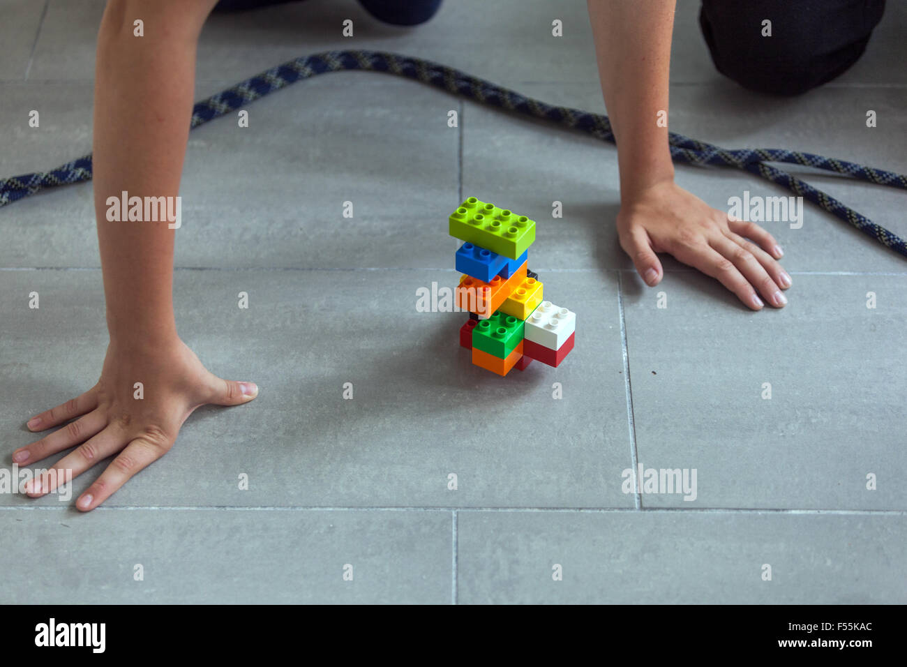 Plastic cubes in the hands of a child's game that develops creativity ...